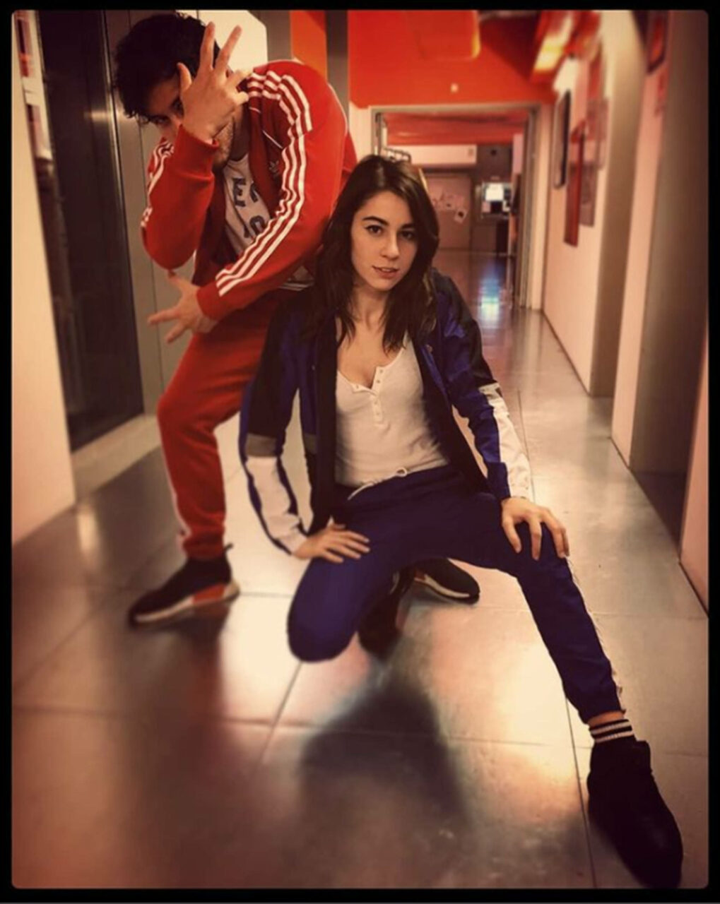 Amy Nelson and Markiplier Colorful Tracksuits Dynamic Poses Wallpaper ...