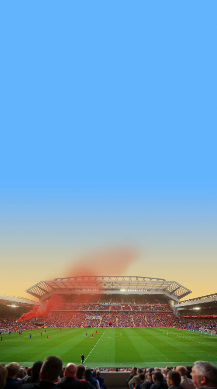 Anfield Stadium Sunset with Fans and Red Smoke Wallpaper | Background ...