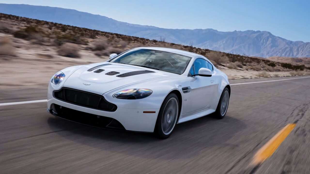 Aston Martin V12 Vantage Speeding on Mountain Highway Wallpaper ...