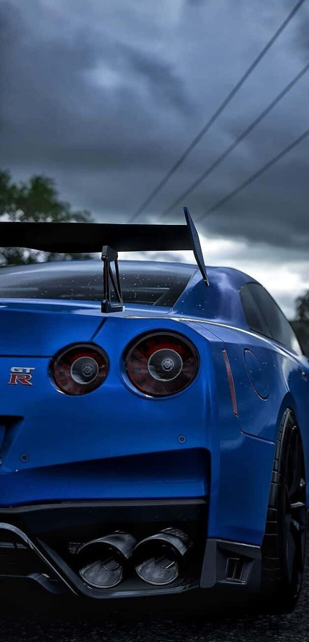 Blue Nissan R35 GTR Rear View Under Moody Sky Wallpaper | Background ...