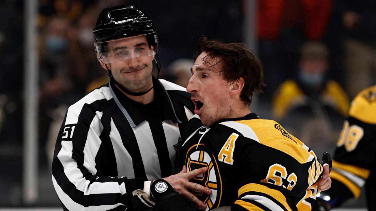 Brad Marchand and NHL Umpire Intense Hockey Game Wallpaper | Background ...