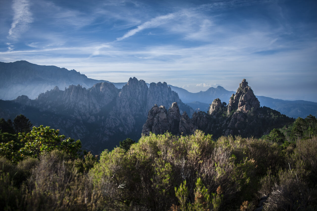 Jagged Rock Formations and Lush Greens Landscape Wallpaper | Background ...