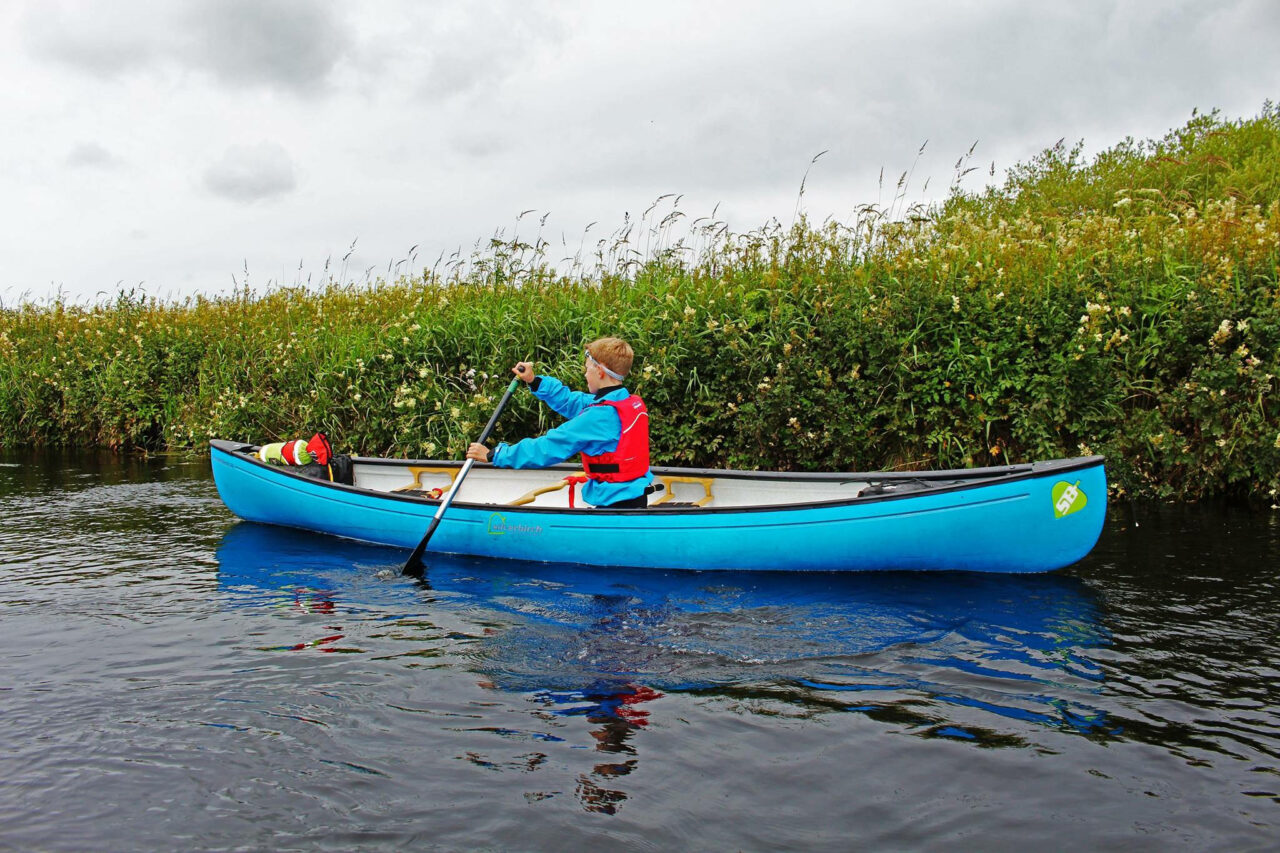 Blue Canoe on Calm River with Green Grass Wallpaper | Background FREE ...
