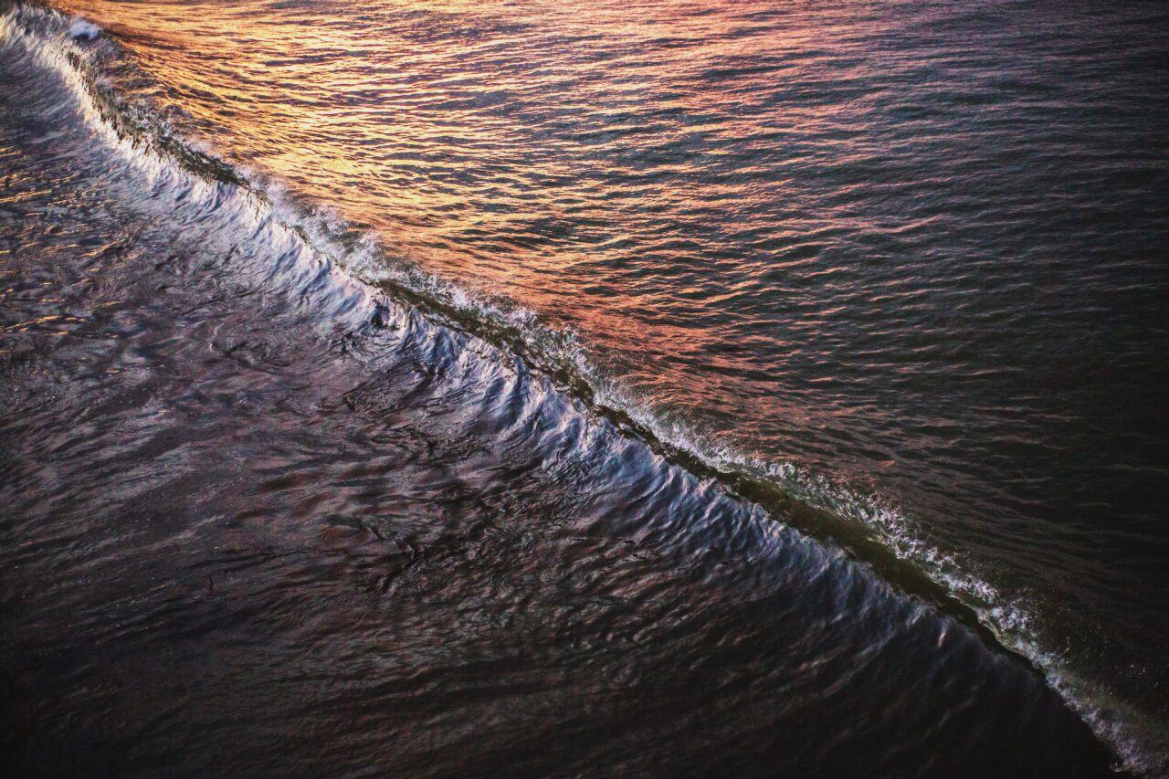 Sunset Ocean Wave with Shimmering Water Wallpaper | Background FREE ...