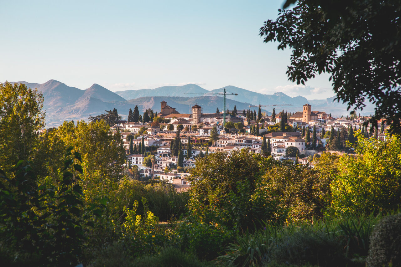 Serene Townscape Embraced by Mountains Wallpaper | Background FREE ...