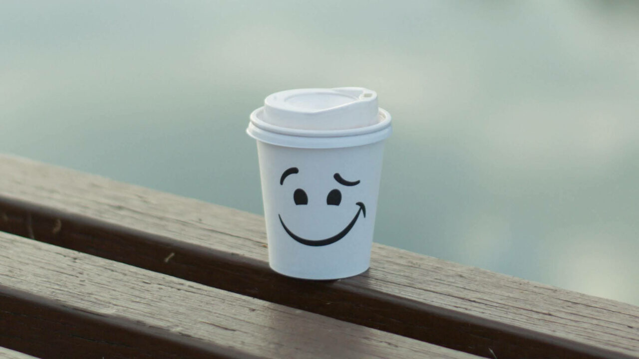 Cheerful Smiley Face Cup on Wooden Bench Wallpaper | Background FREE ...