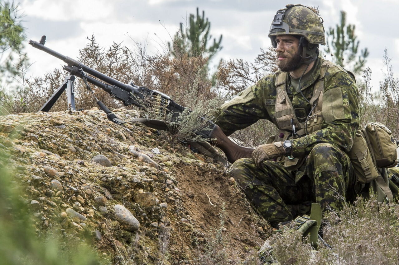 Defending Freedom: Majestic Military Soldier Armed with Powerful Weapon ...