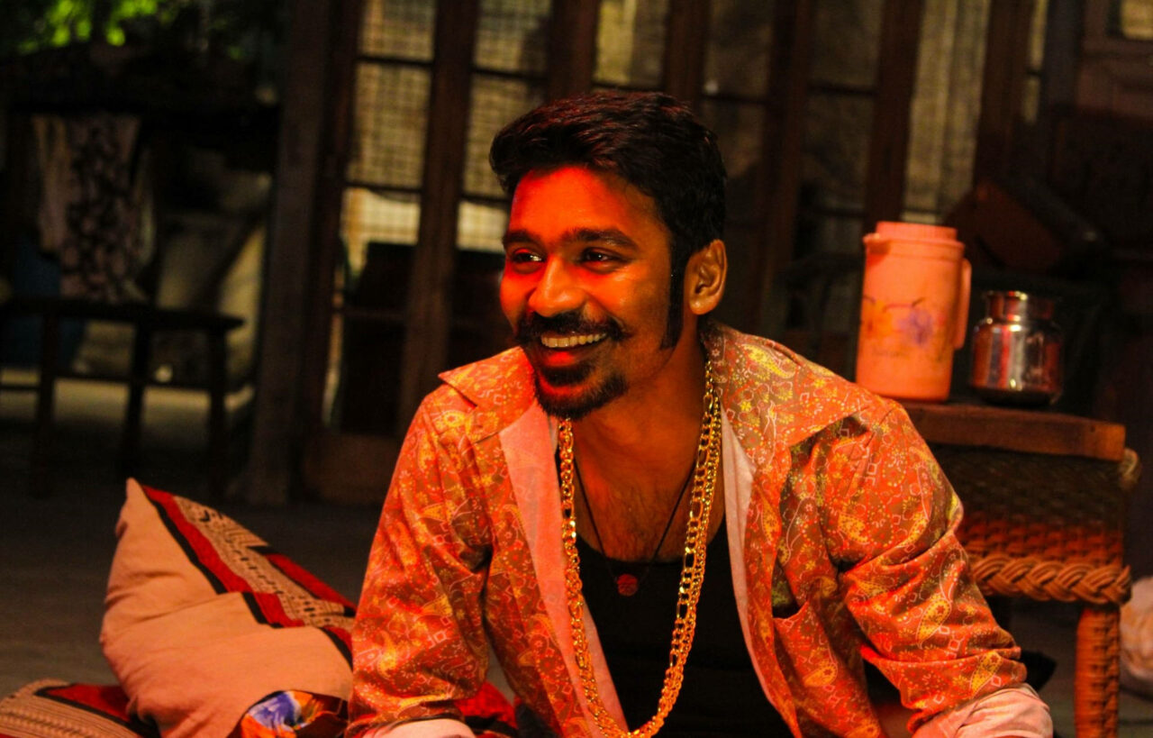 Dhanush Maari Smiling Playful Look Colorful Shirt Wallpaper ...