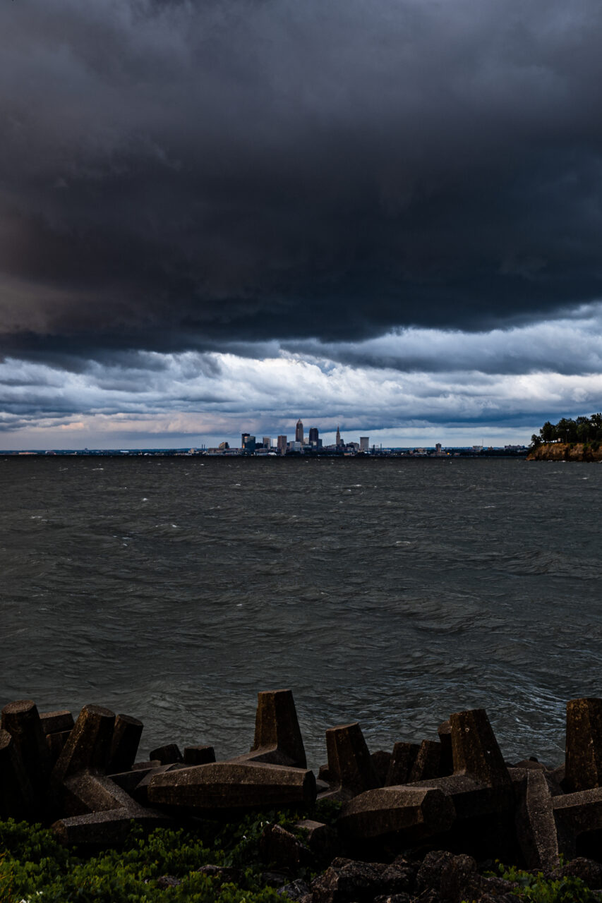 Moody Cityscape Over Stormy Sea Coastal Shore Wallpaper | Background ...