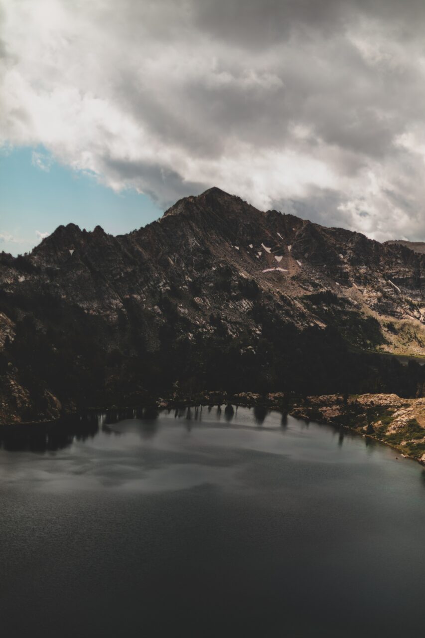 Moody Mountain Peaks Over Calm Lake Earthy Tone Wallpaper | Background ...