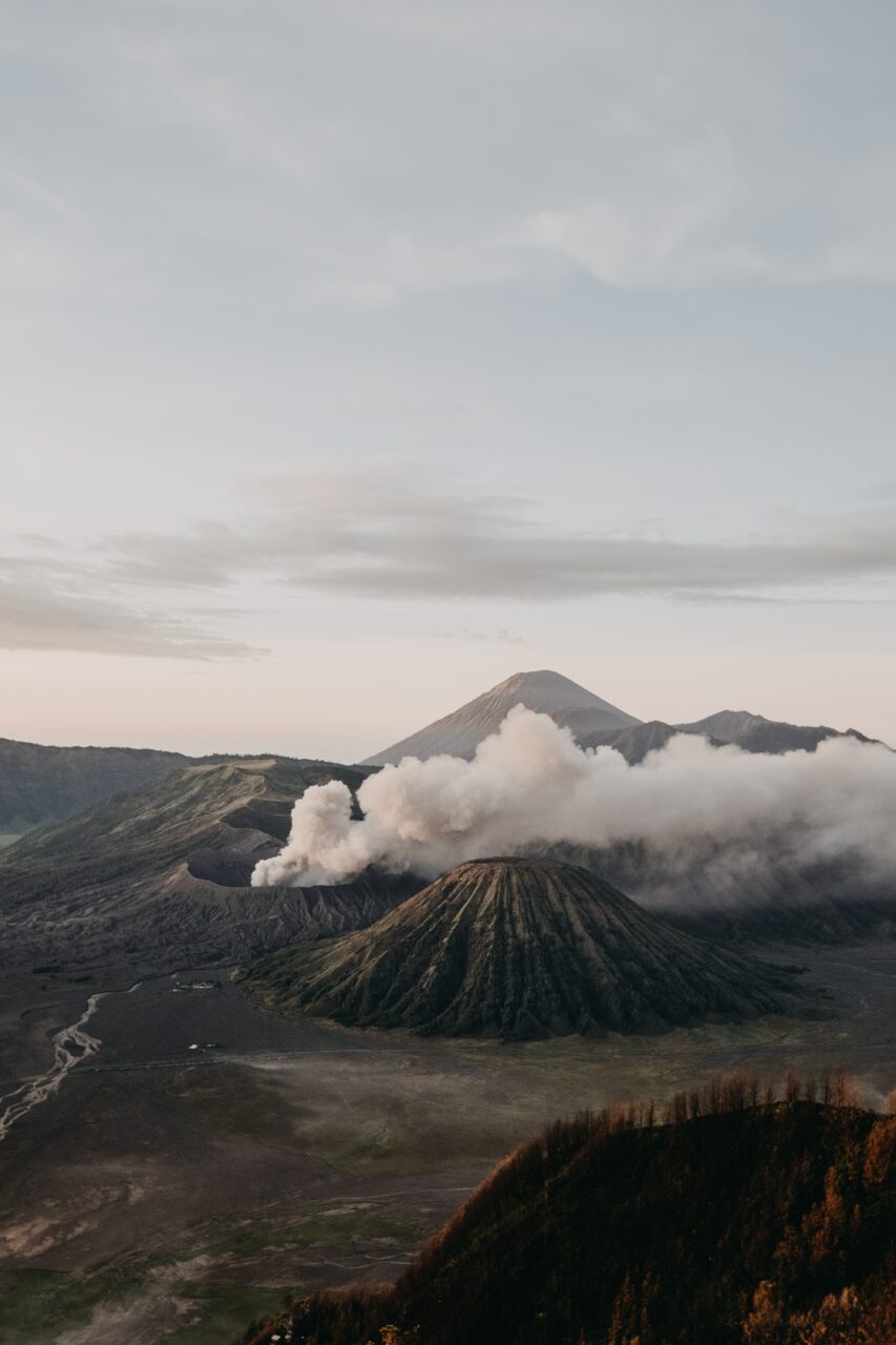 Volcanic Eruption Craters with Smoke Rugged Terrain Wallpaper ...