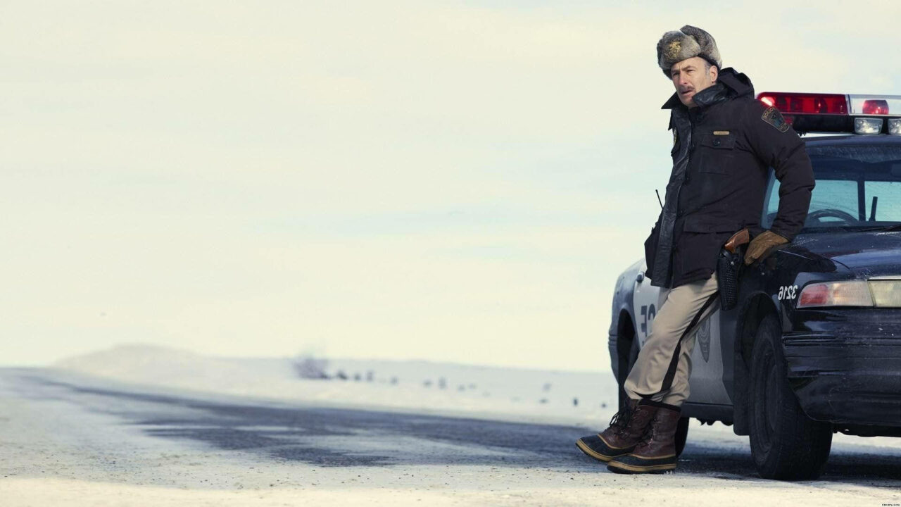 Fargo 2014 Character by Police Car Snowy Roadside Wallpaper ...