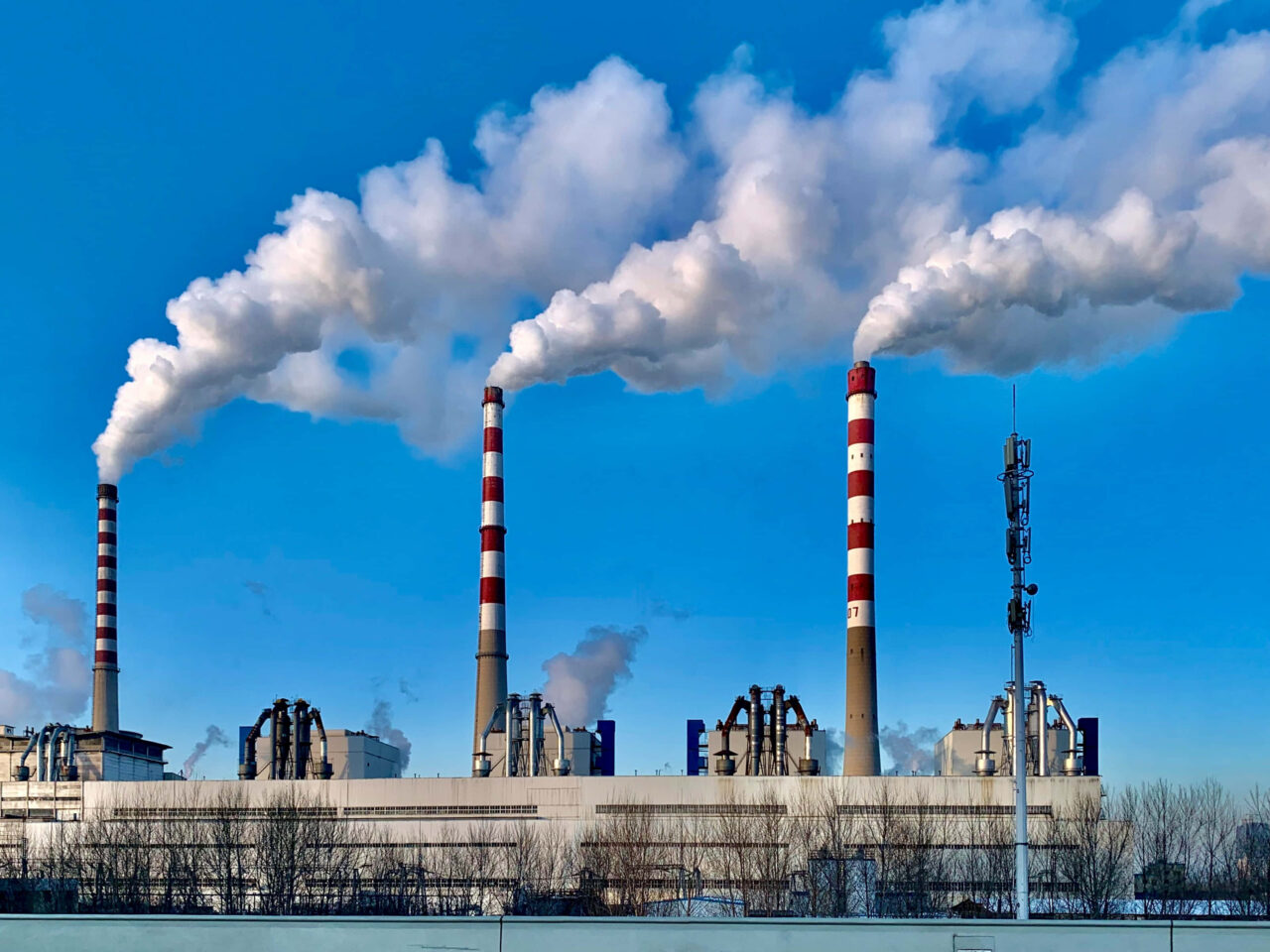 Industrial Smokestacks and Urban Skyline Factory Wallpaper | Background ...