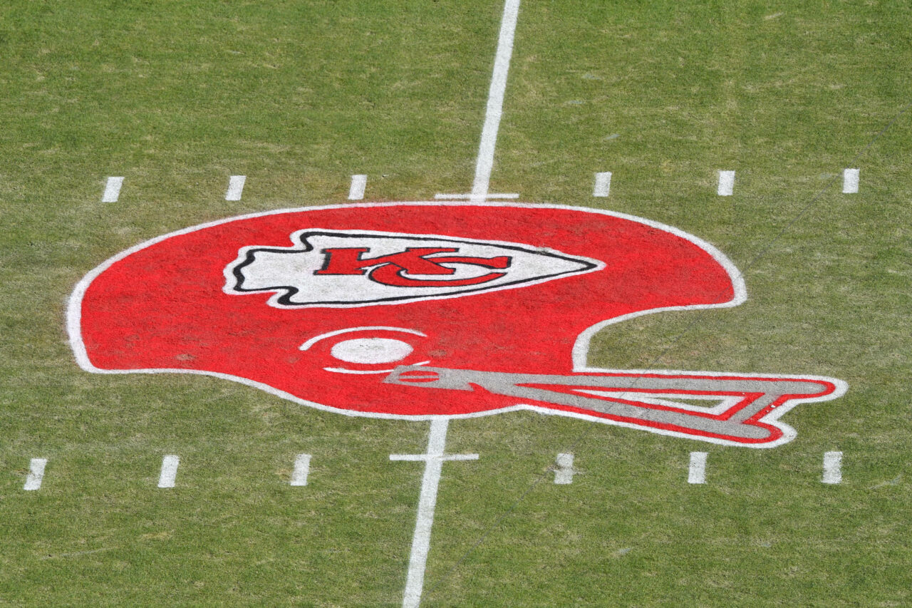 Kansas City Chiefs Iconic Logo on Football Field Wallpaper | Background ...