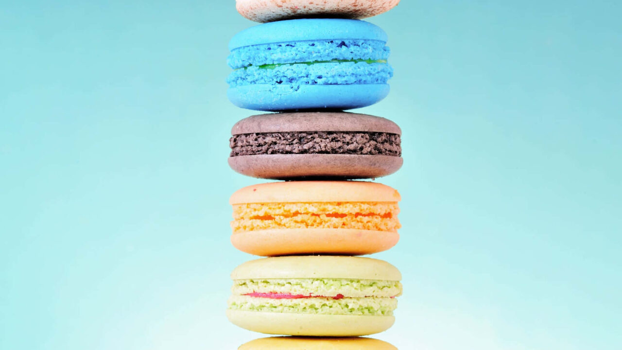 Vibrant Macarons Stacked in Precision Wallpaper | Background FREE ...