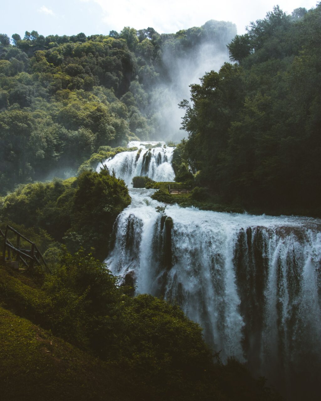 Majestic Multi-Tiered Waterfall in Lush Forest Wallpaper | Background ...