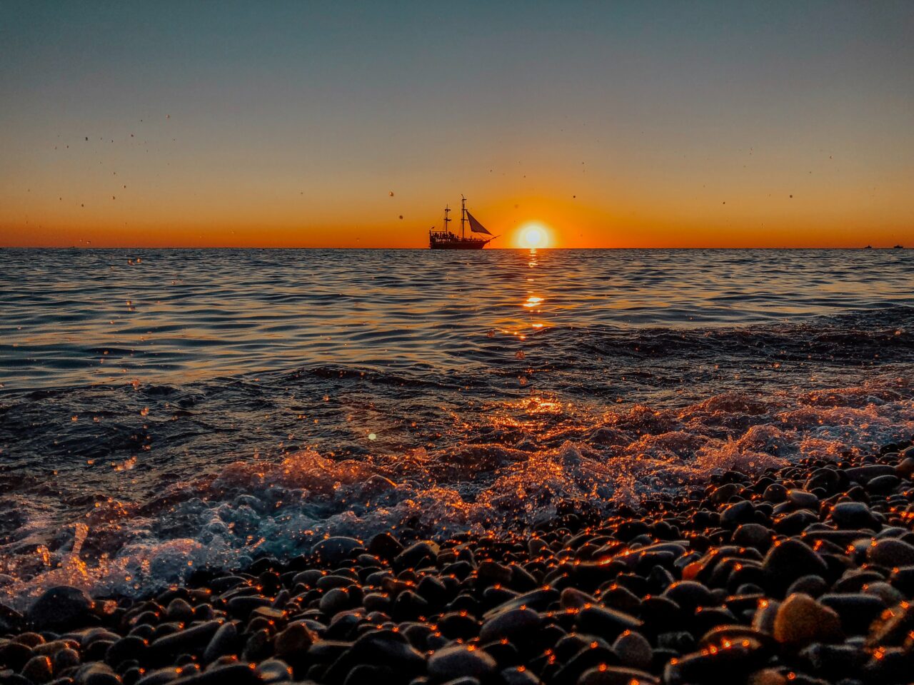 Majestic Sunset Ship Sailing Calm Waters Wallpaper | Background FREE ...