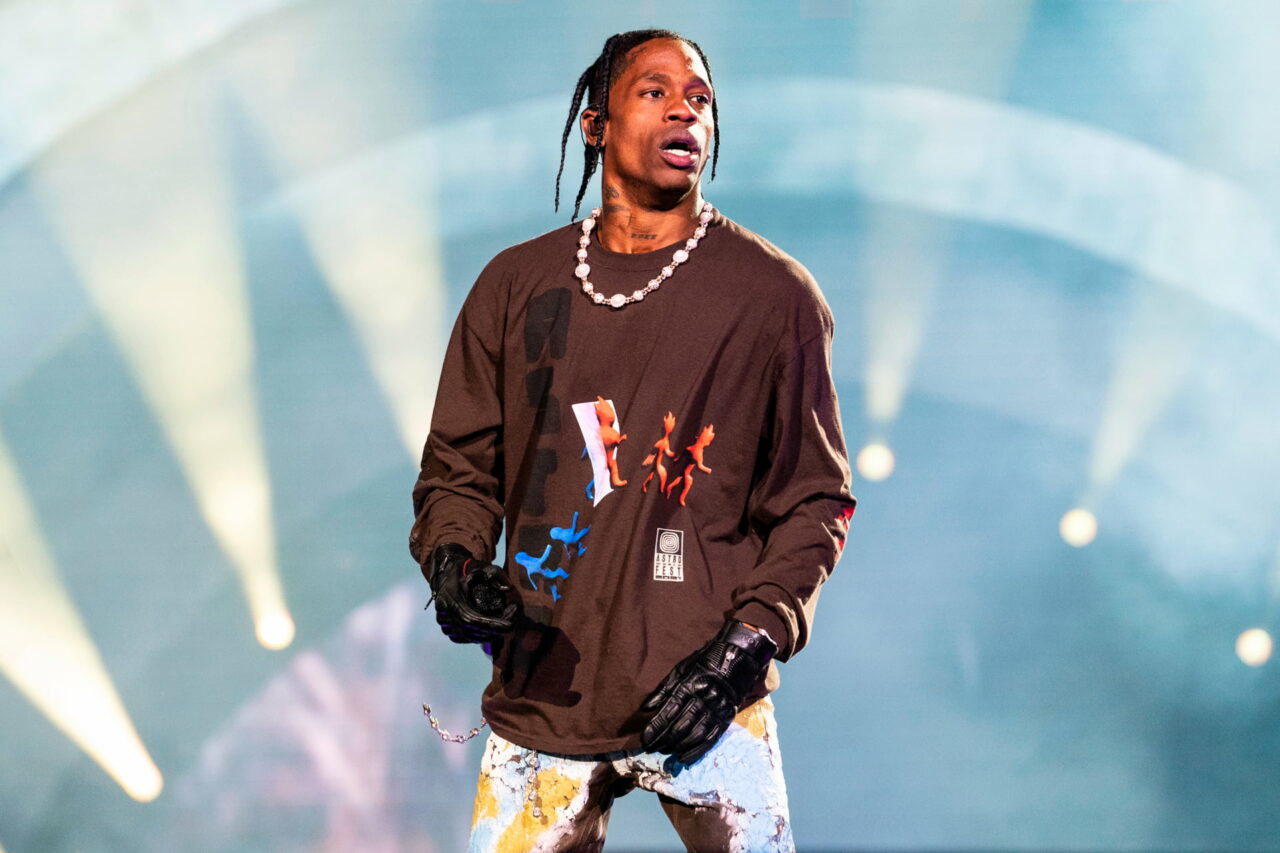Travis Scott in Electrifying Performance Wallpaper | Background FREE ...
