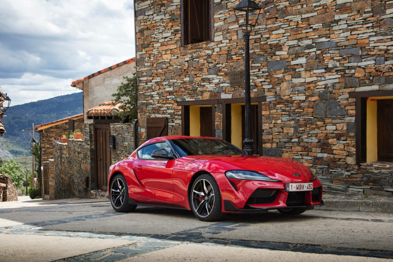 Red Toyota Supra Parked by Traditional Buildings 4K Wallpaper ...