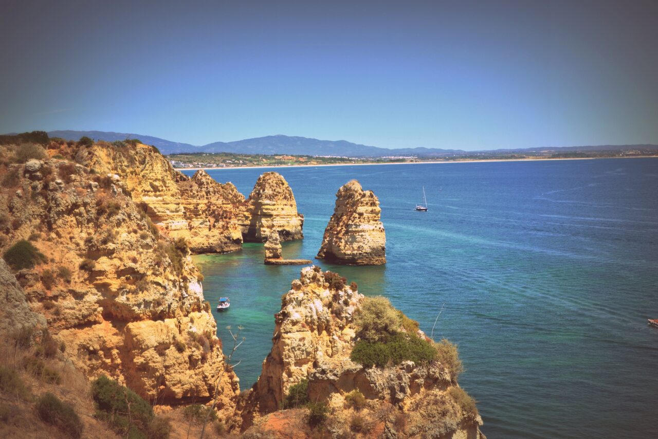 Serene Coastal Rocks and Blue Sea Landscape Wallpaper | Background FREE ...