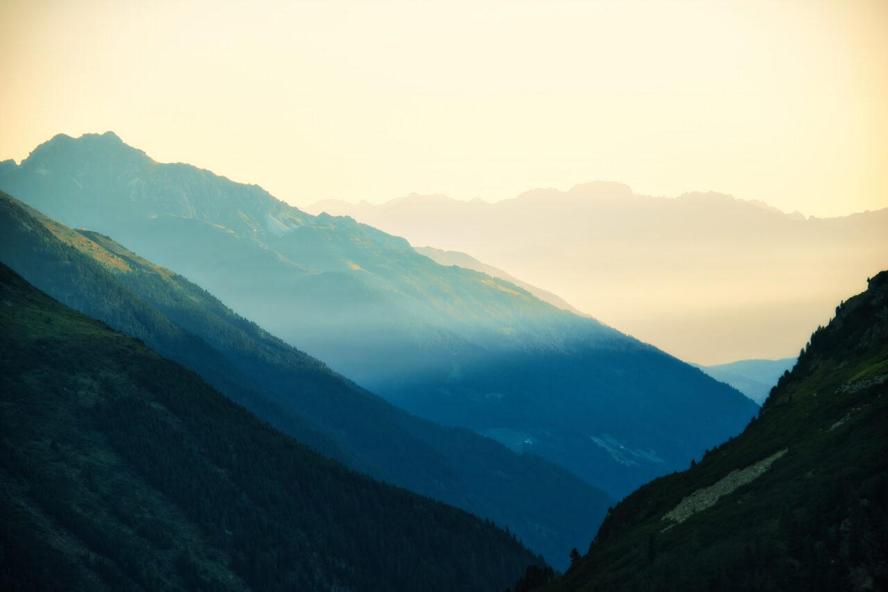 Golden Morning Fog Over Serene Mountain Peaks Wallpaper | Background ...