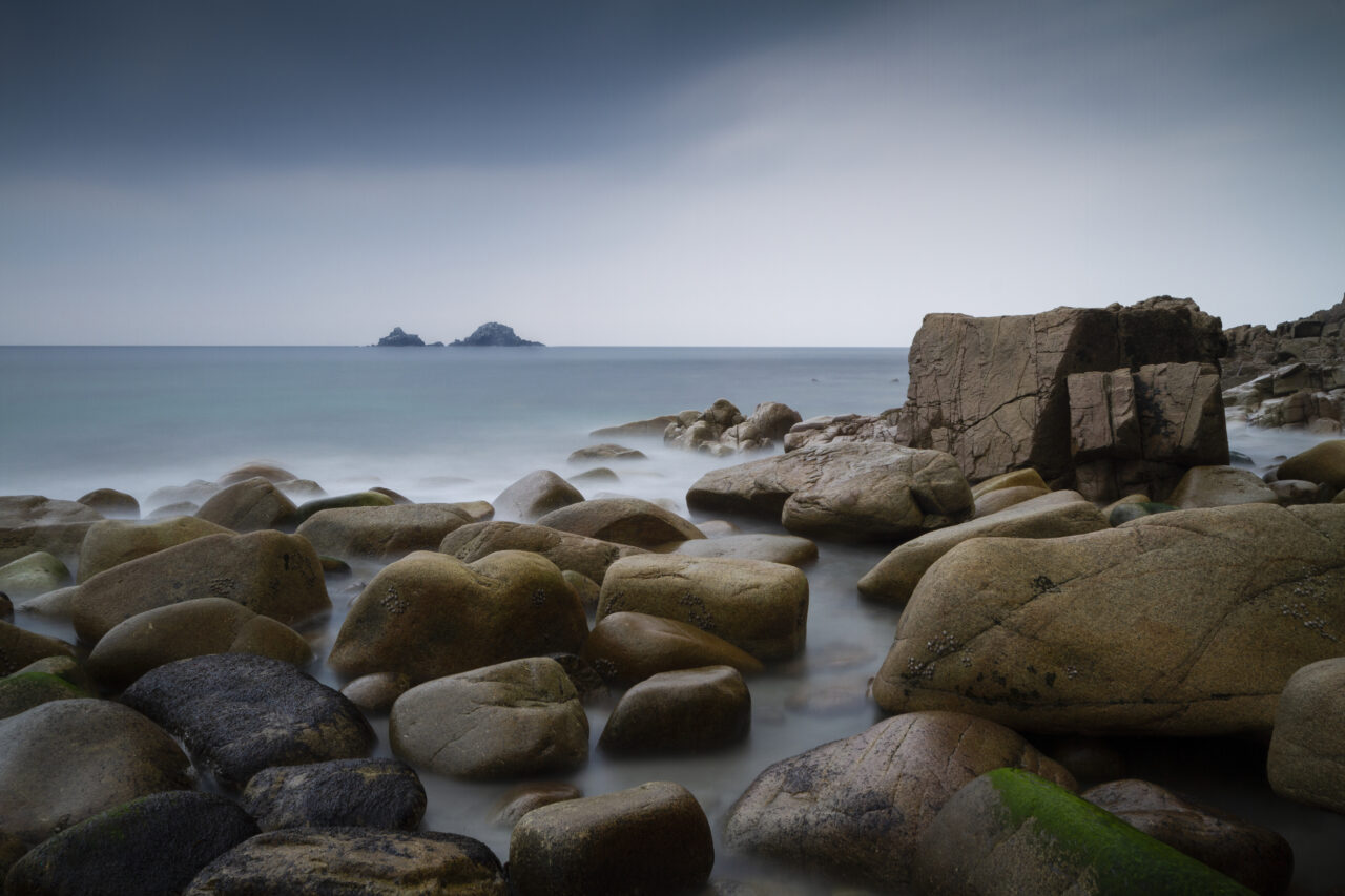 Misty Shore with Smooth Stones Serene Sea Wallpaper | Background FREE ...