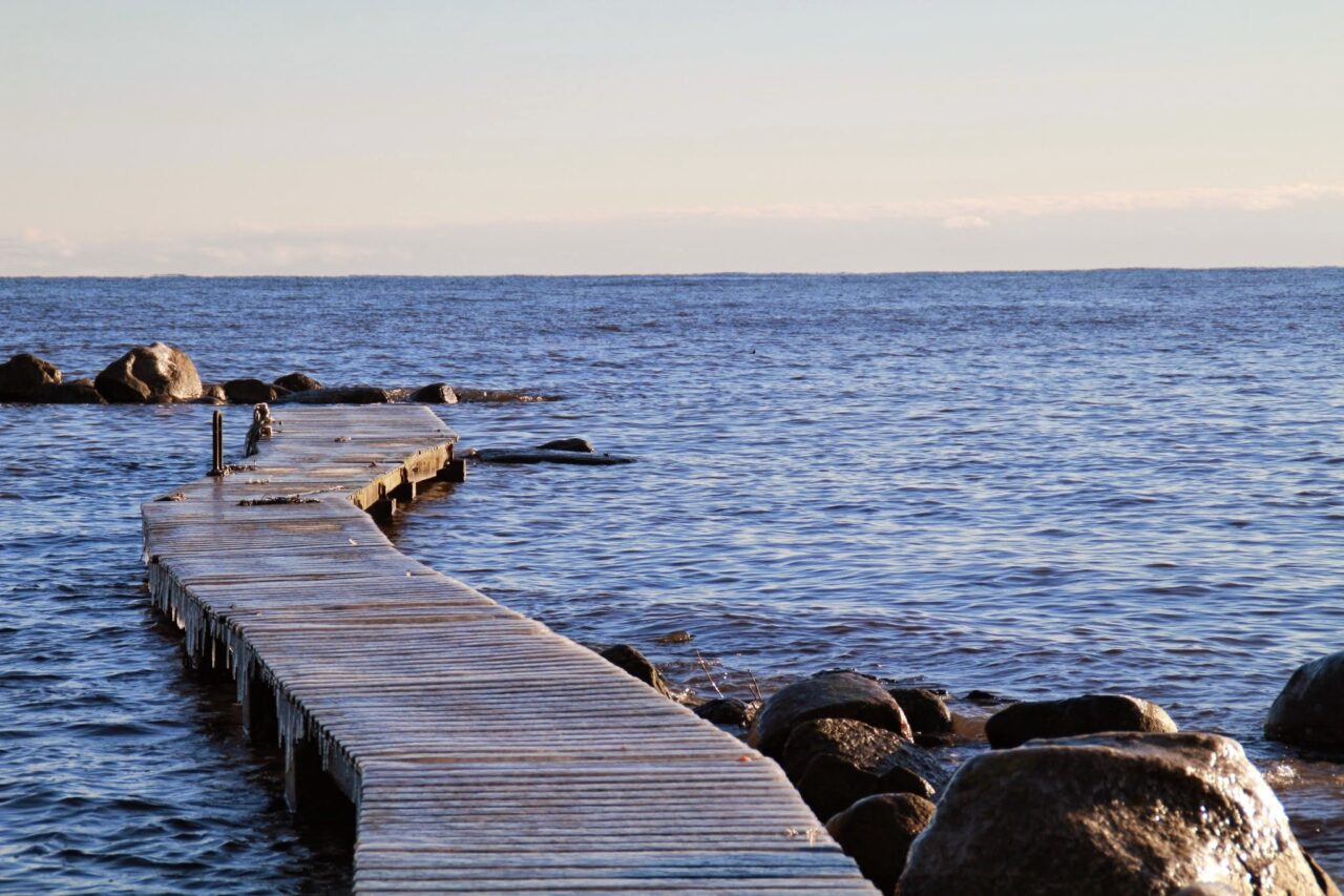 Serene Swedish Seaside Pier Blue Waters Wallpaper | Background FREE ...