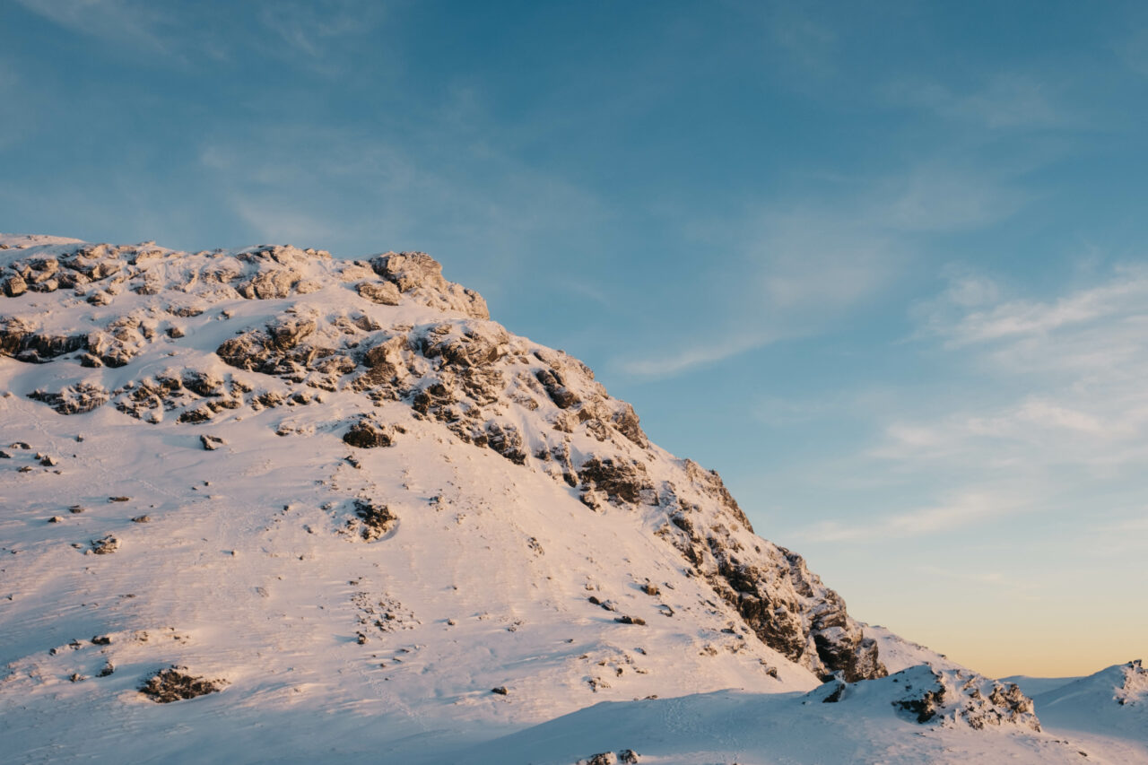 Golden Sunlit Snowy Hill with Rocks Winter Wallpaper | Background FREE ...