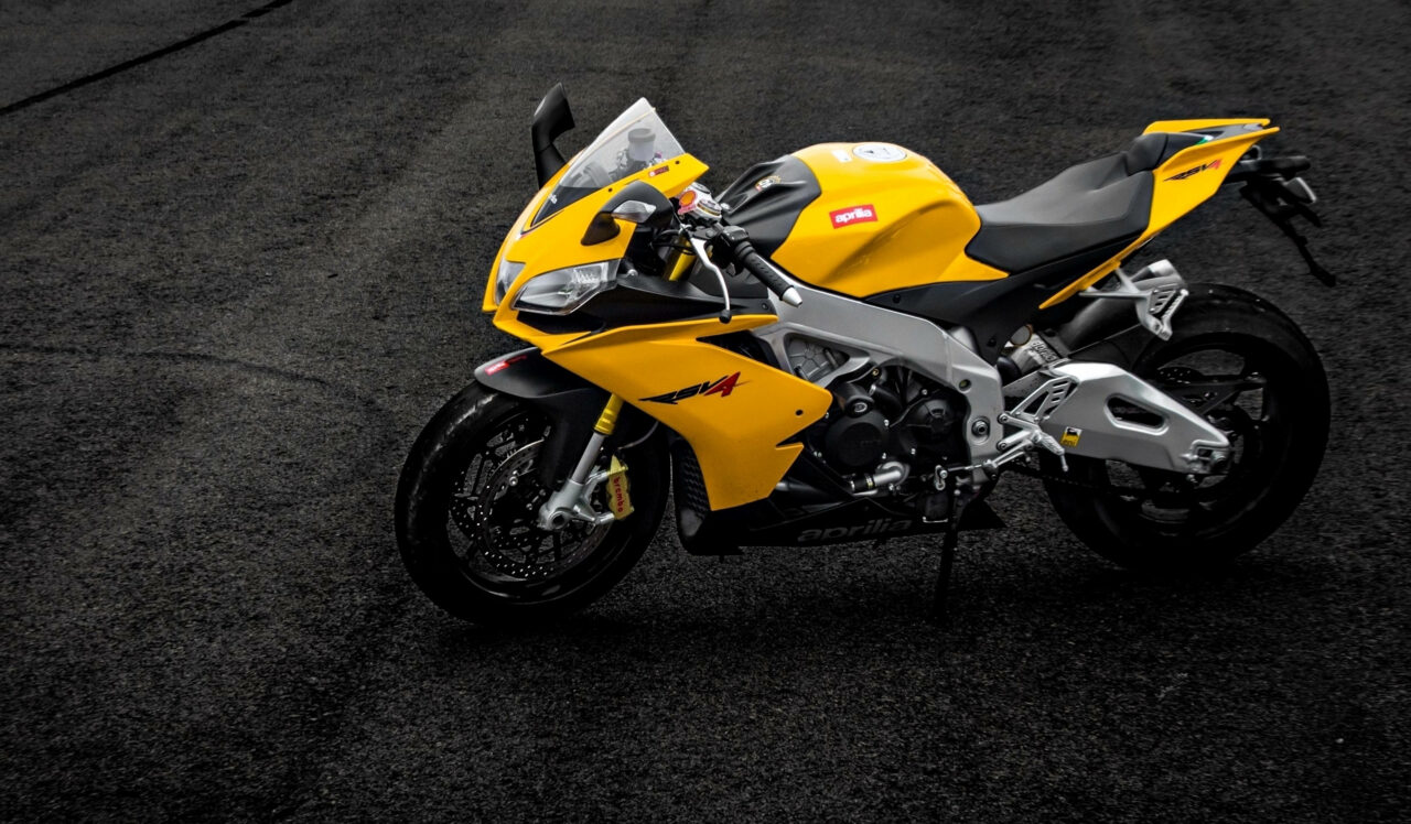 Sleek Black and Yellow Aprilia Motorcycle Wallpaper | Background FREE ...