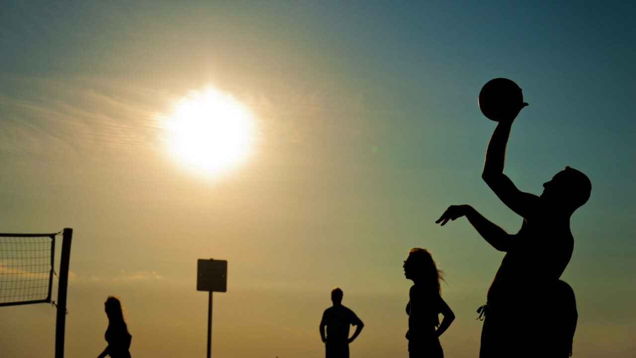 Sunset Silhouettes of Beach Volleyball Wallpaper | Background FREE ...