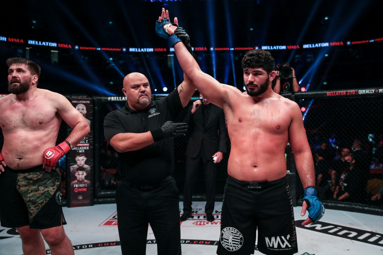 Victorious MMA Fighter Celebrated in Bellator Cage Wallpaper ...